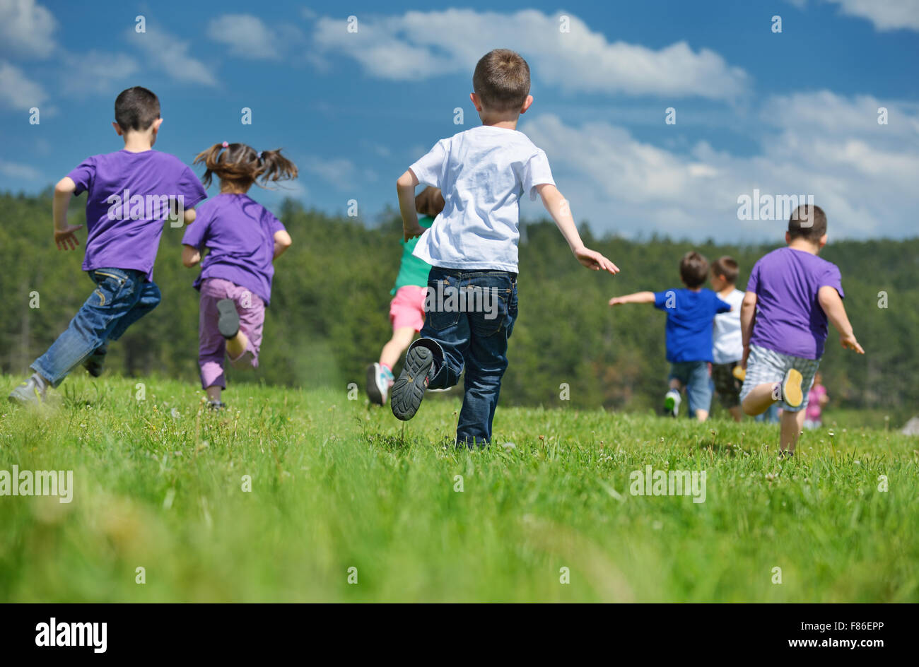 happy kids group have fun in nature outdoors park Stock Photo - Alamy