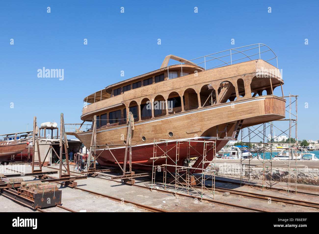 Traditional wooden dhow in a dockyard of Manama, Kingdom of Bahrain ...
