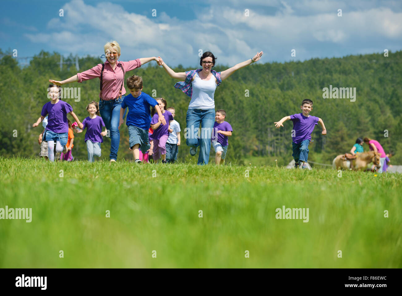 happy kids group have fun in nature outdoors park Stock Photo - Alamy