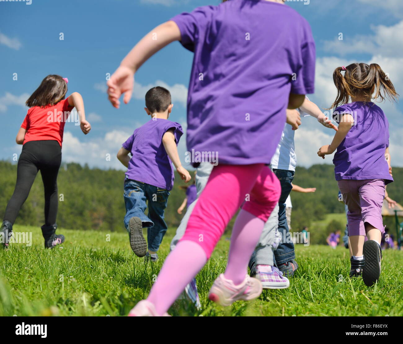 happy kids group have fun in nature outdoors park Stock Photo - Alamy