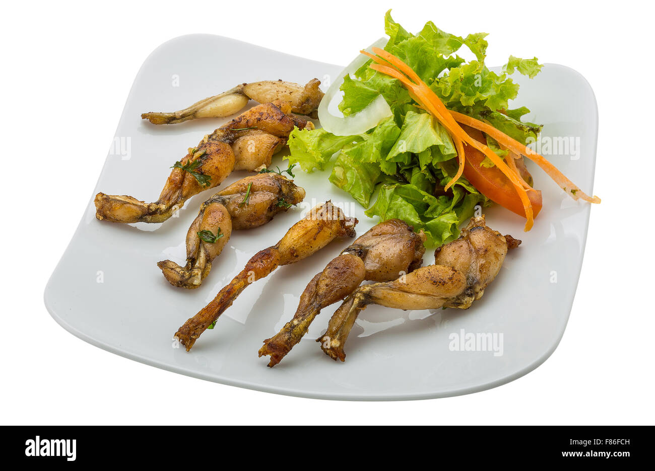 Grilled frog legs - French style Stock Photo - Alamy