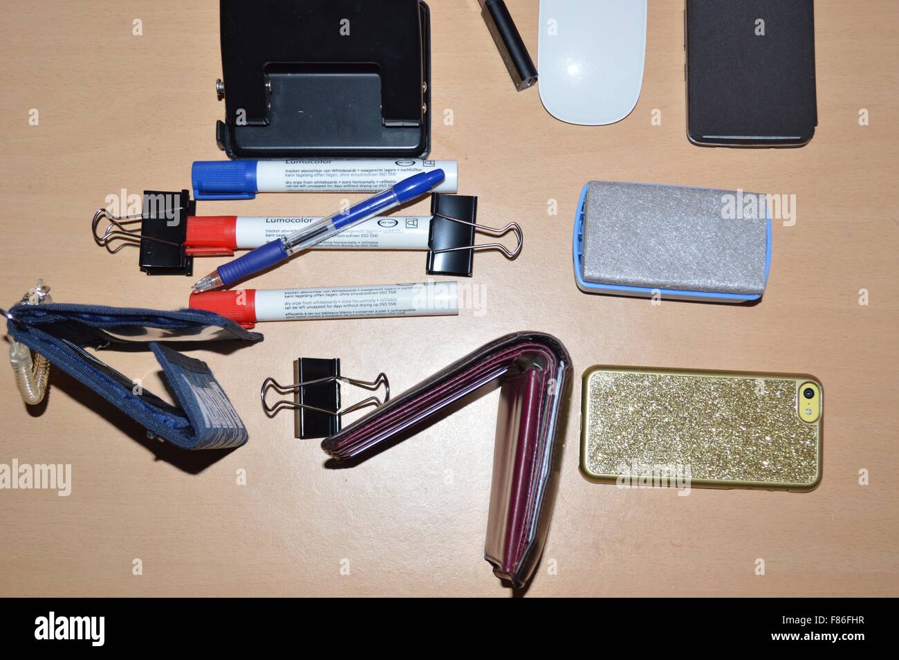 A messy study table of student with electronic devices and study stuffs ...