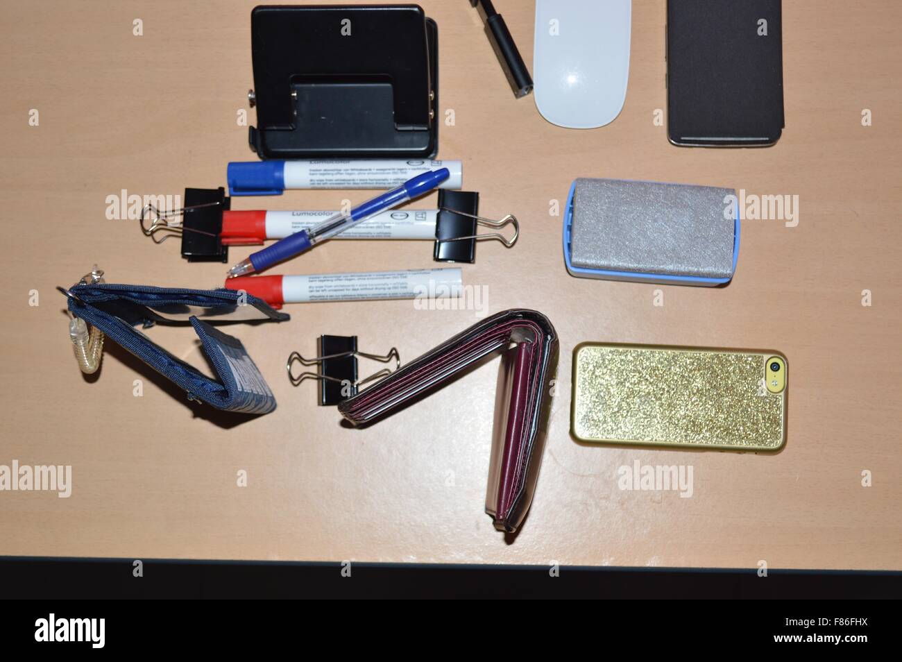 A messy study table of student with electronic devices and study stuffs ...