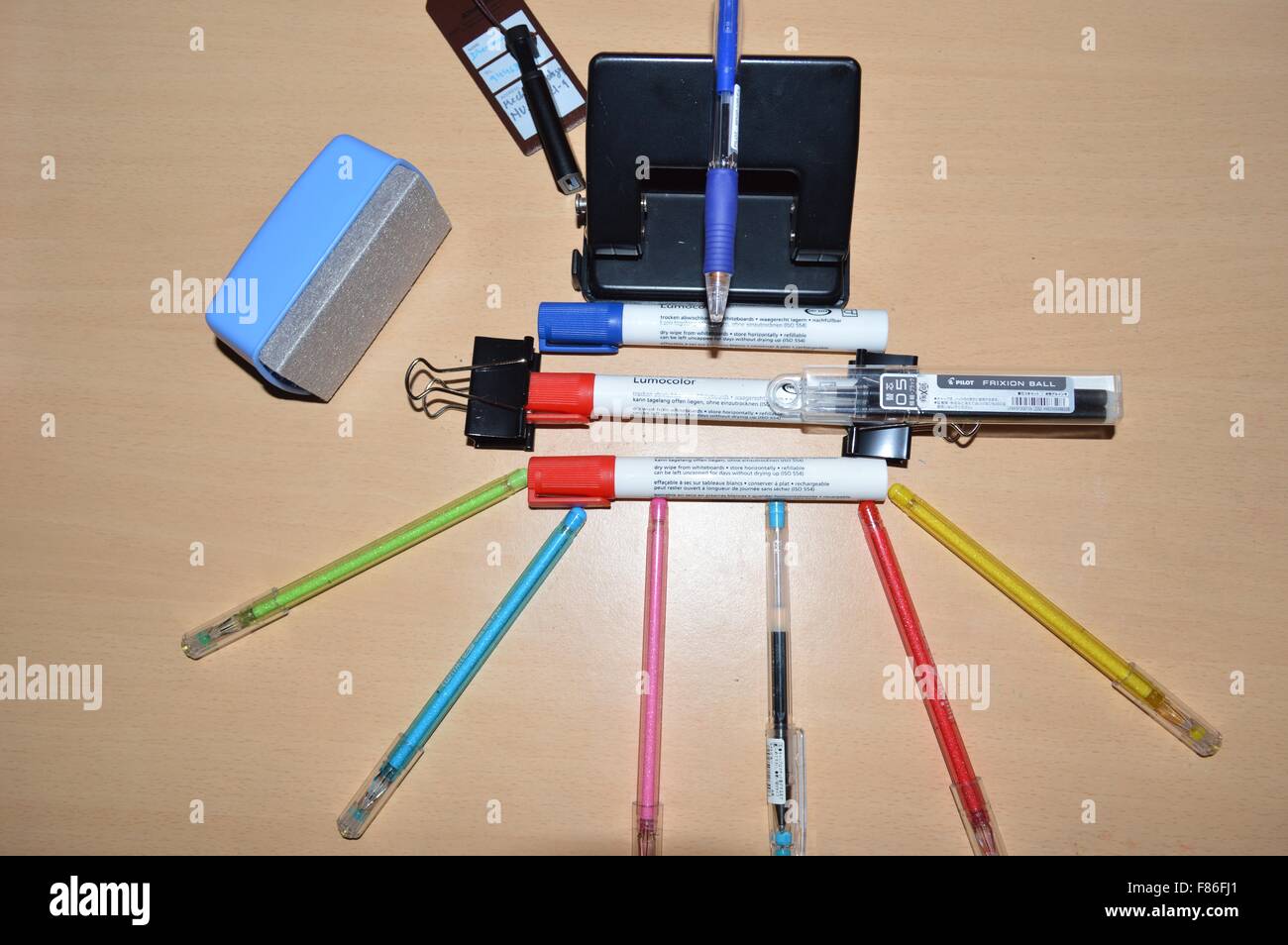 A messy study table of student with electronic devices and study stuffs ...