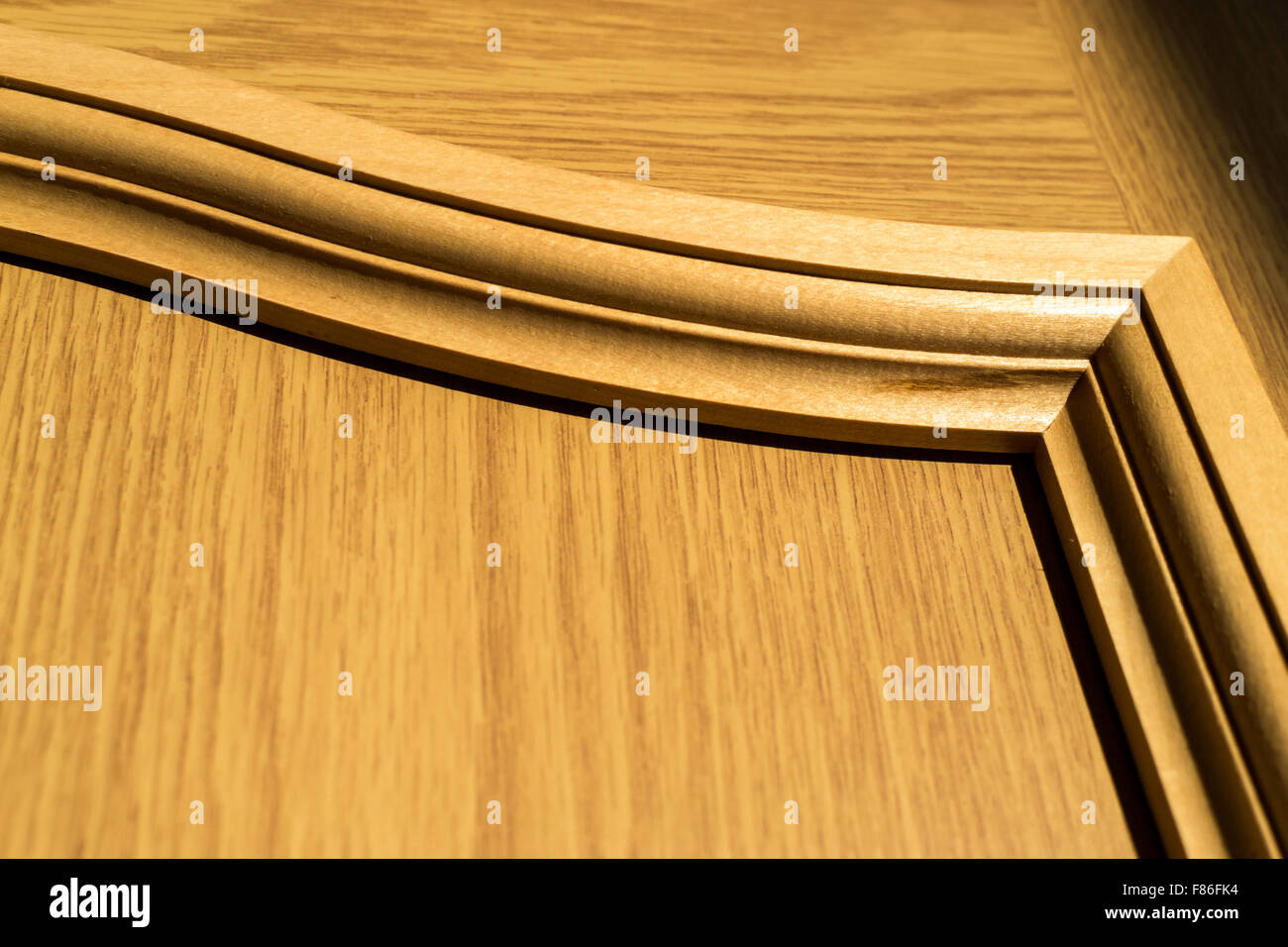 Close-up image of wooden door frame with natural sunlight showing the ...