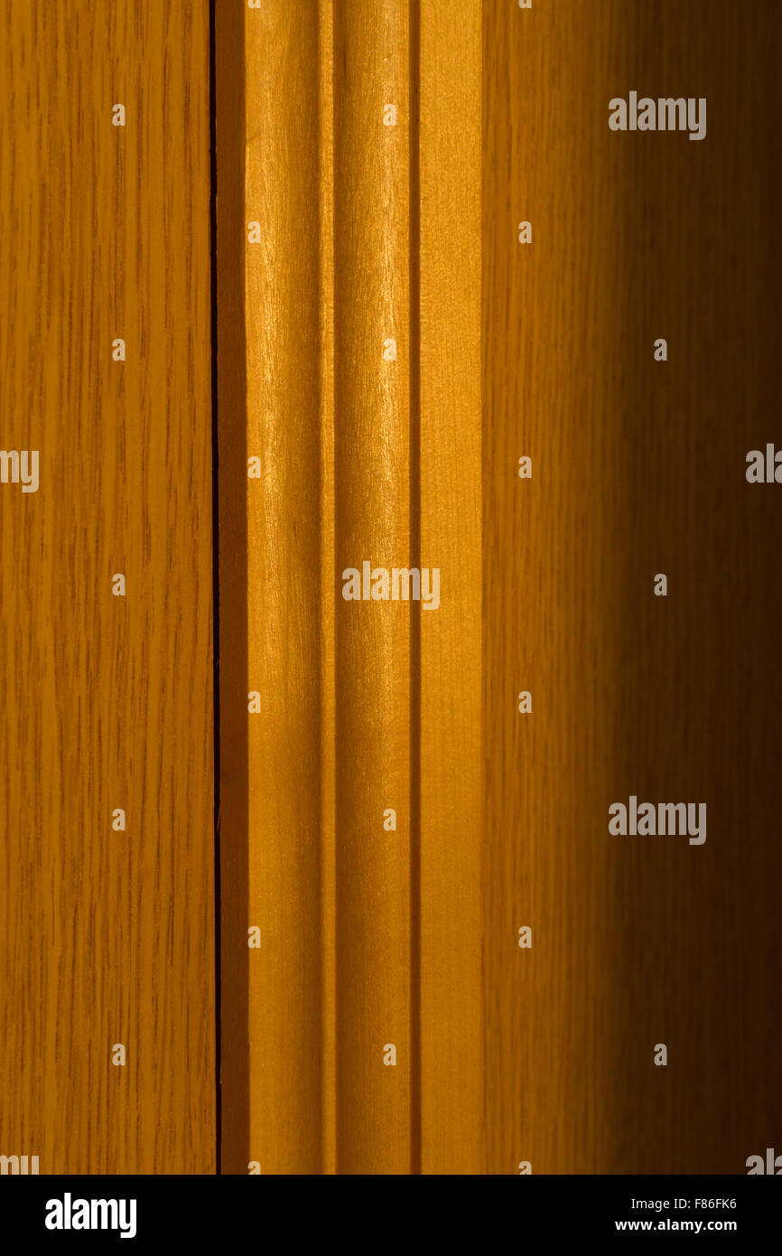 Close-up image of wooden door frame with natural sunlight showing the ...