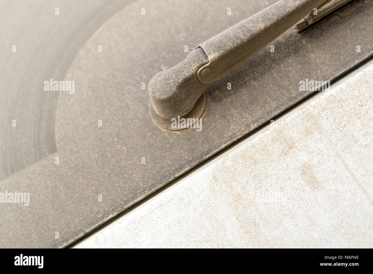 Closeup of dust covered car windscreen wipers which needs a carwash to ...