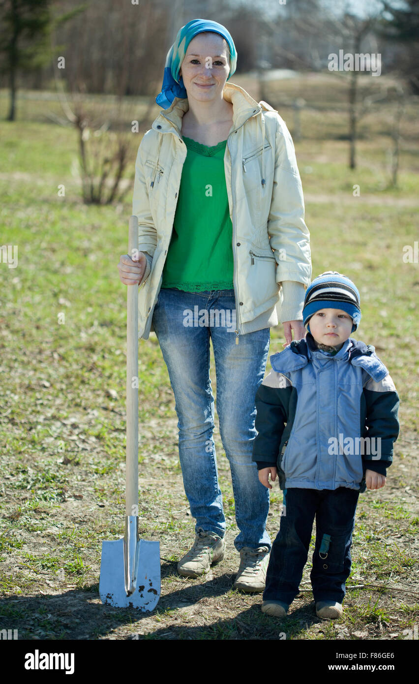 young woman with her son working with spade outdoor Stock Photo - Alamy