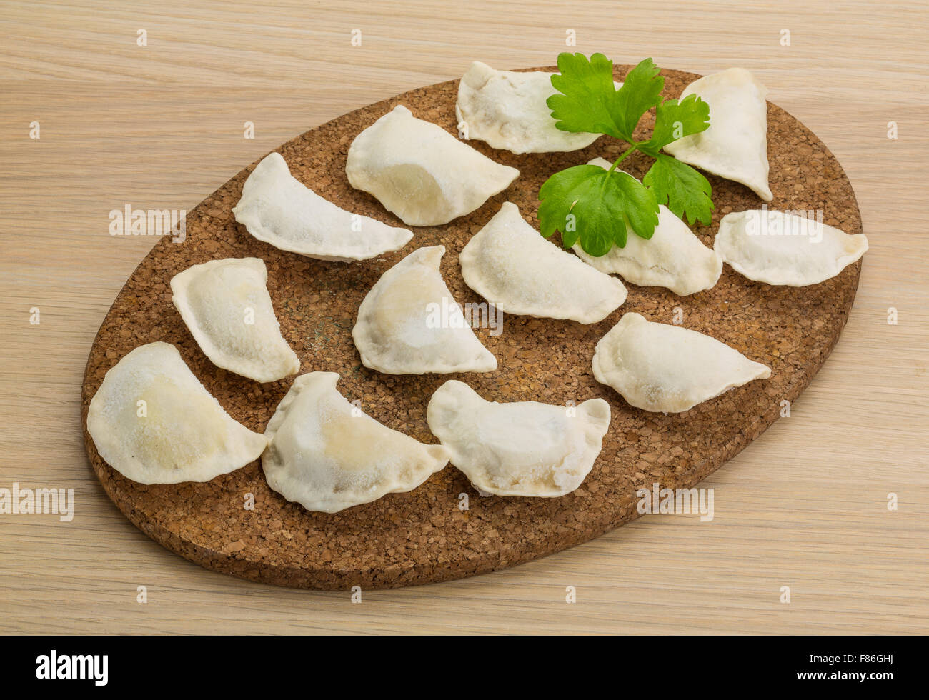 Raw Ukrainian vareniki on the board Stock Photo - Alamy