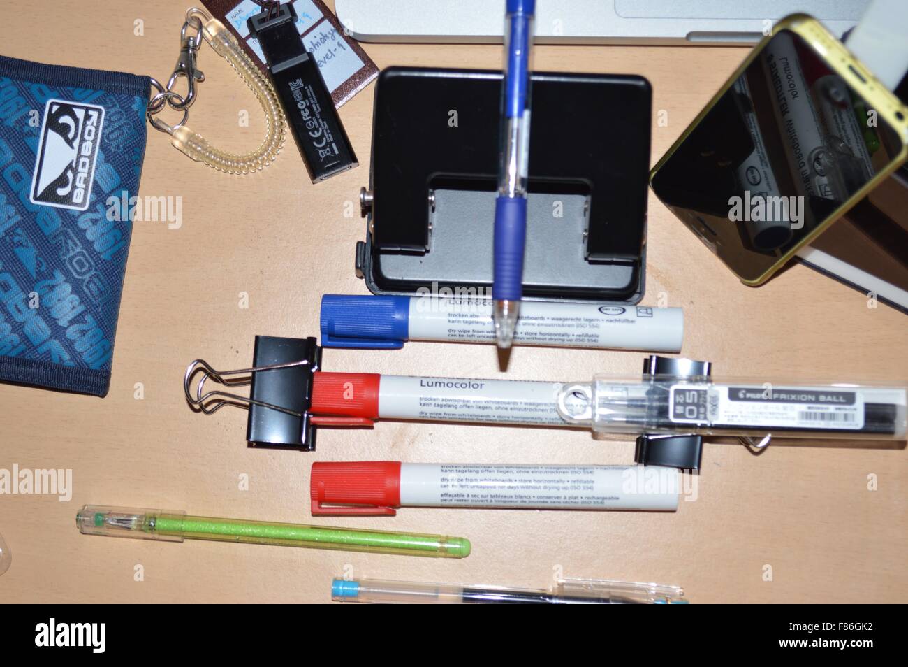 A messy study table of student with electronic devices and study stuffs ...