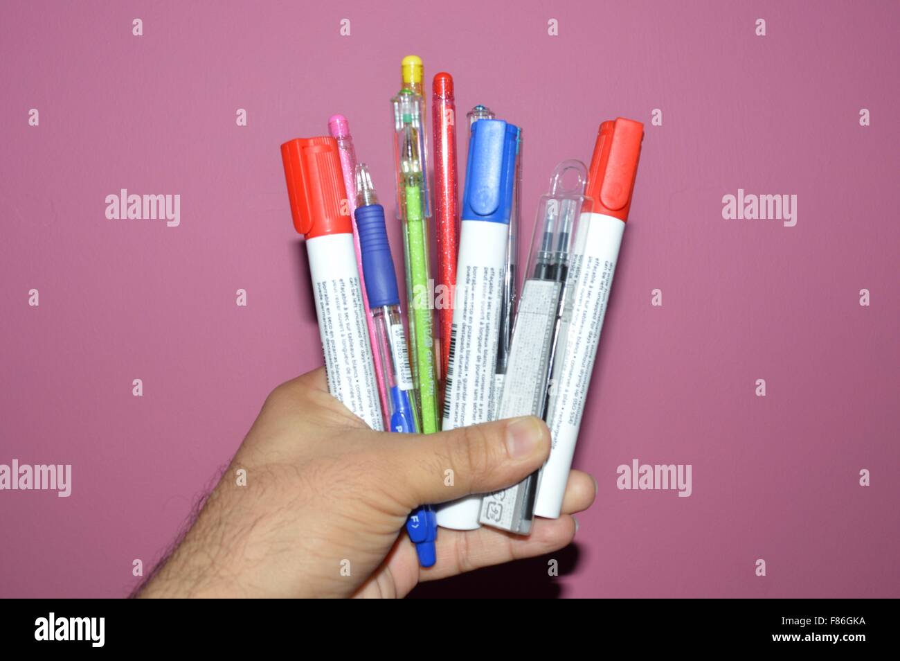 Multicolor pen set and white-board marker pen in human hand Stock Photo ...