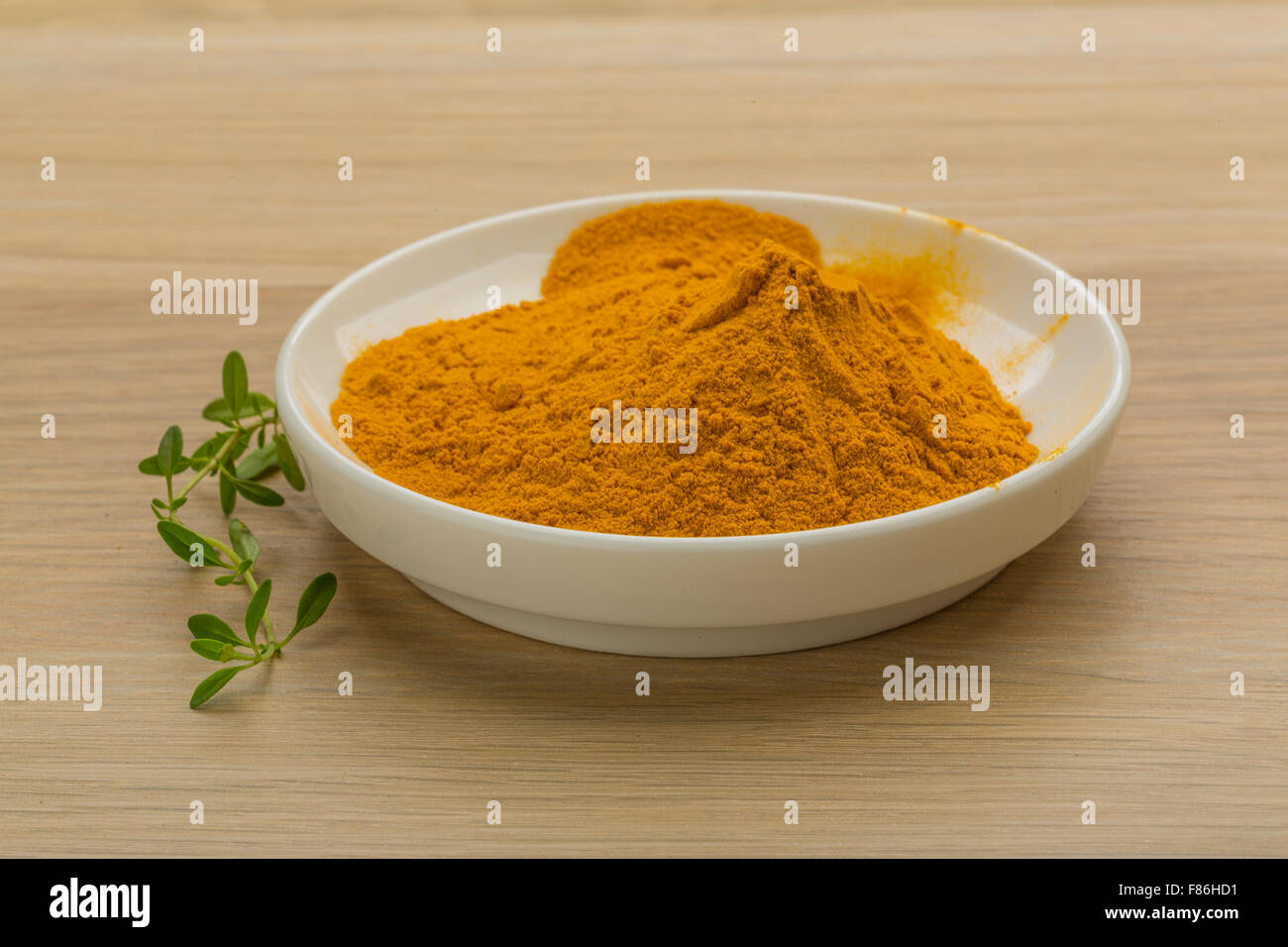 Curcuma powder in the bowl Stock Photo - Alamy