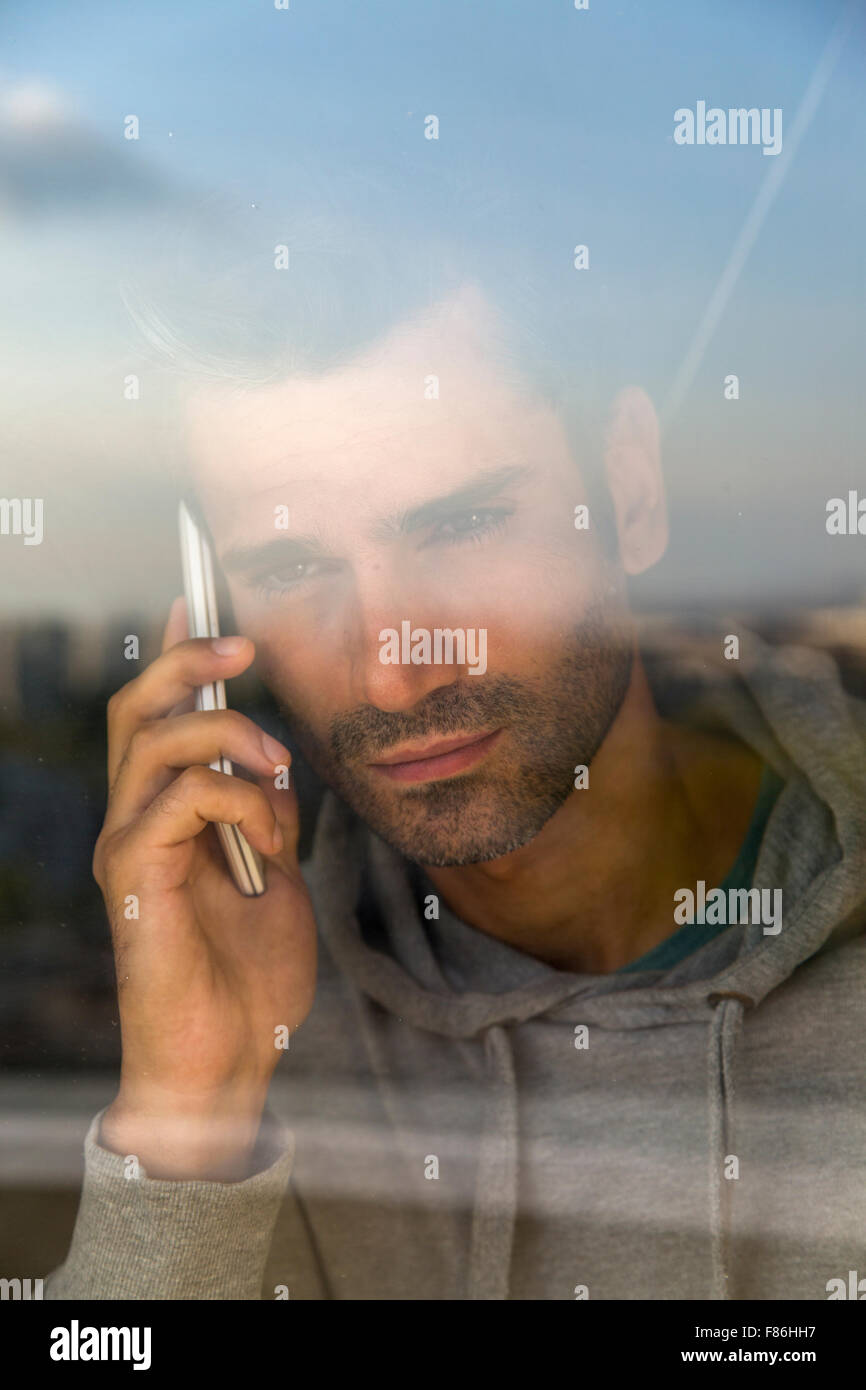 Young man with mobile phone Stock Photo - Alamy