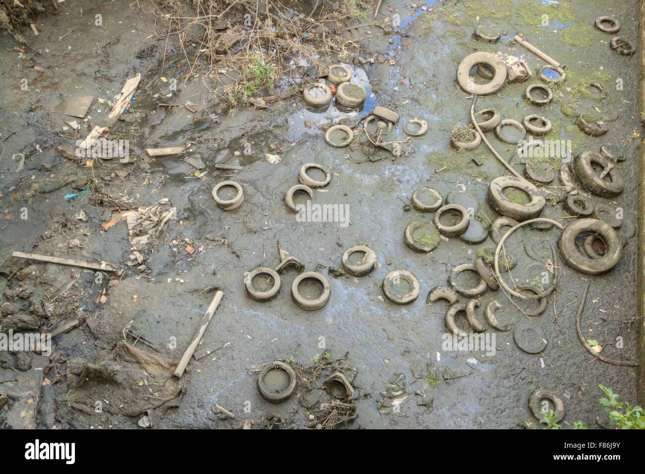 Abandoned Old Tires and Other Waste in Muddy Riverbed Thames Estuary ...