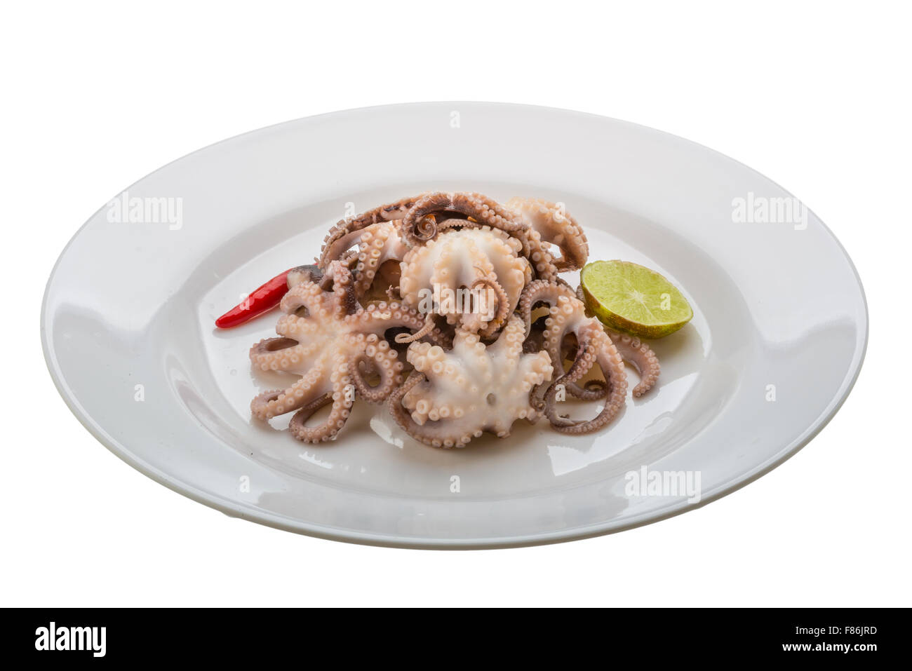 Boiled octopus with pepper and lime Stock Photo - Alamy