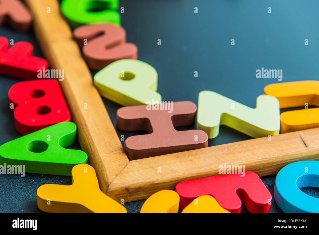 Corner of black board with colorful alphabet3 Stock Photo - Alamy