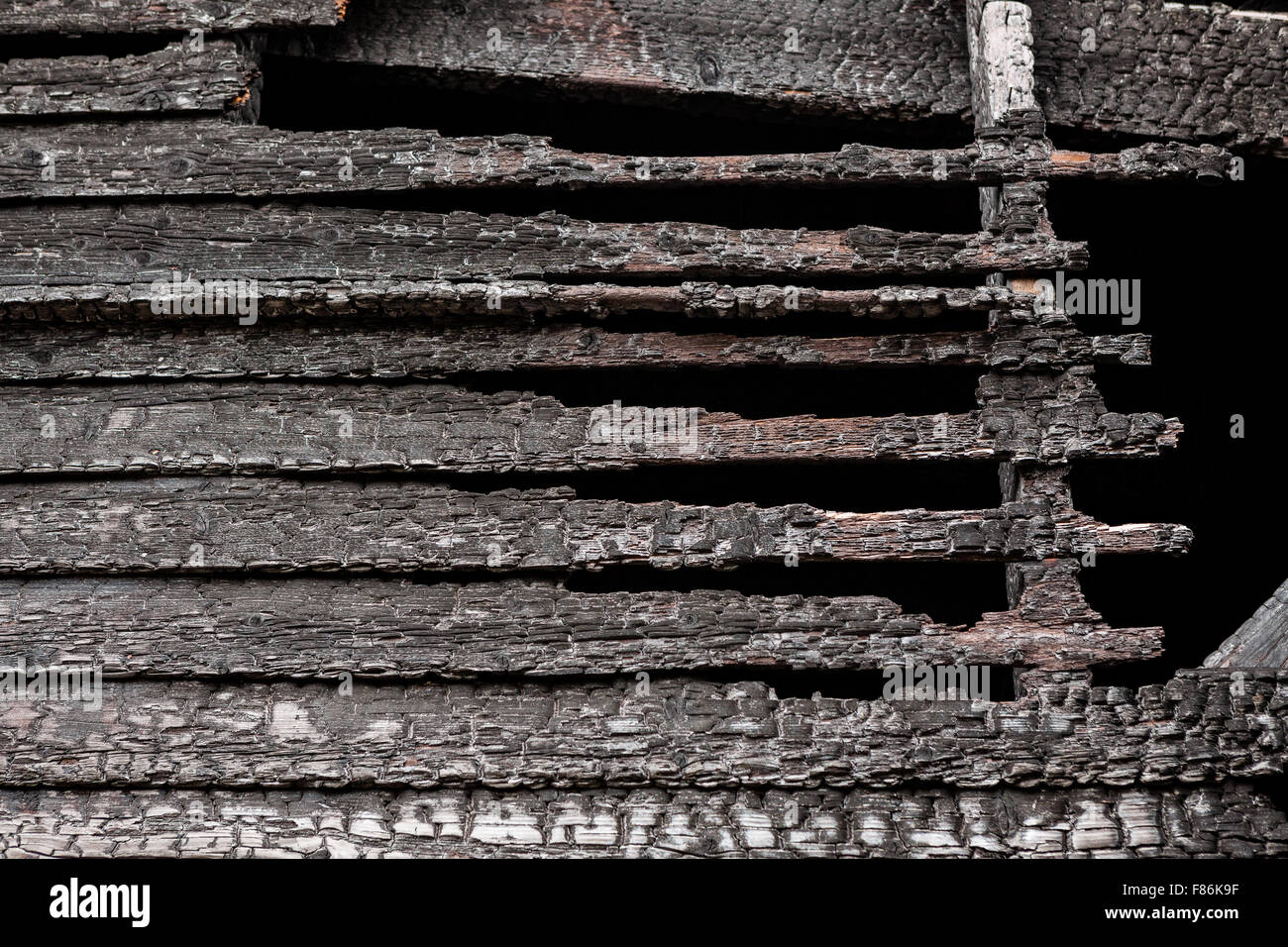 Burnt broken wood wall Stock Photo - Alamy