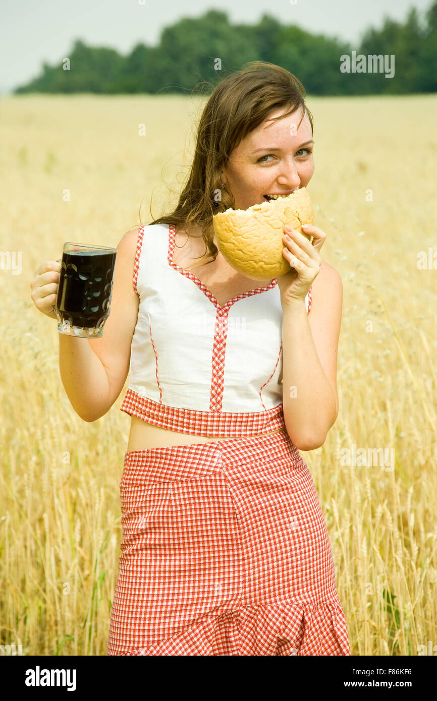 Girl with quass and bread at wheat field Stock Photo - Alamy