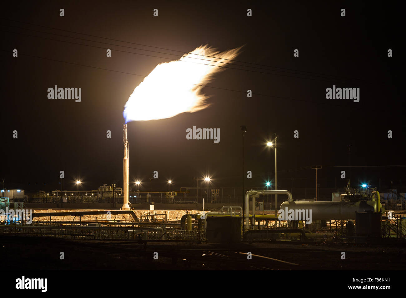 Gas flame torch on a oil refinery plant. Oil industry Stock Photo - Alamy