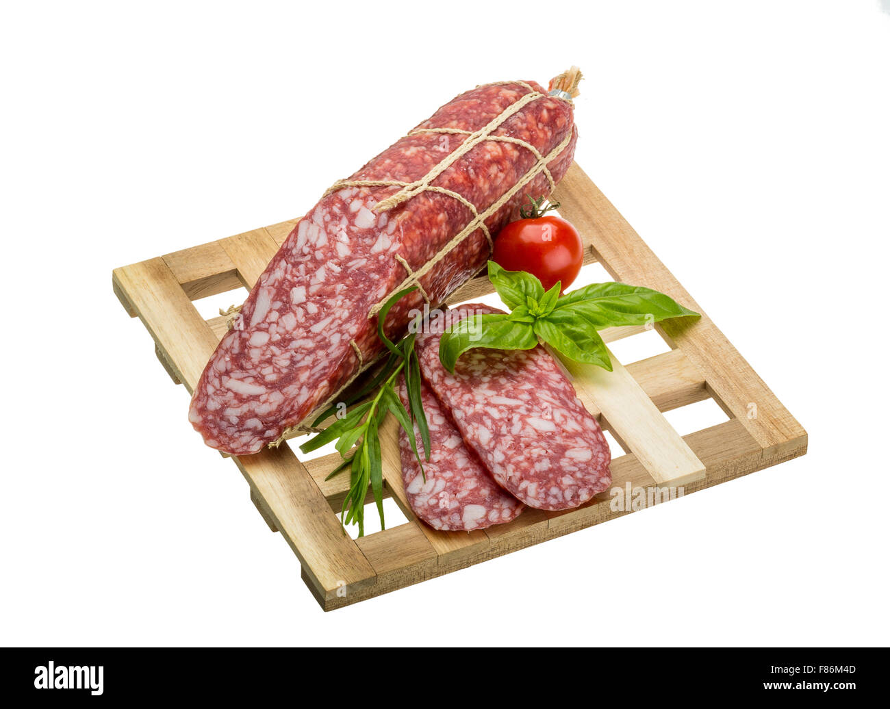 Salami sausages sliced with basil Stock Photo - Alamy