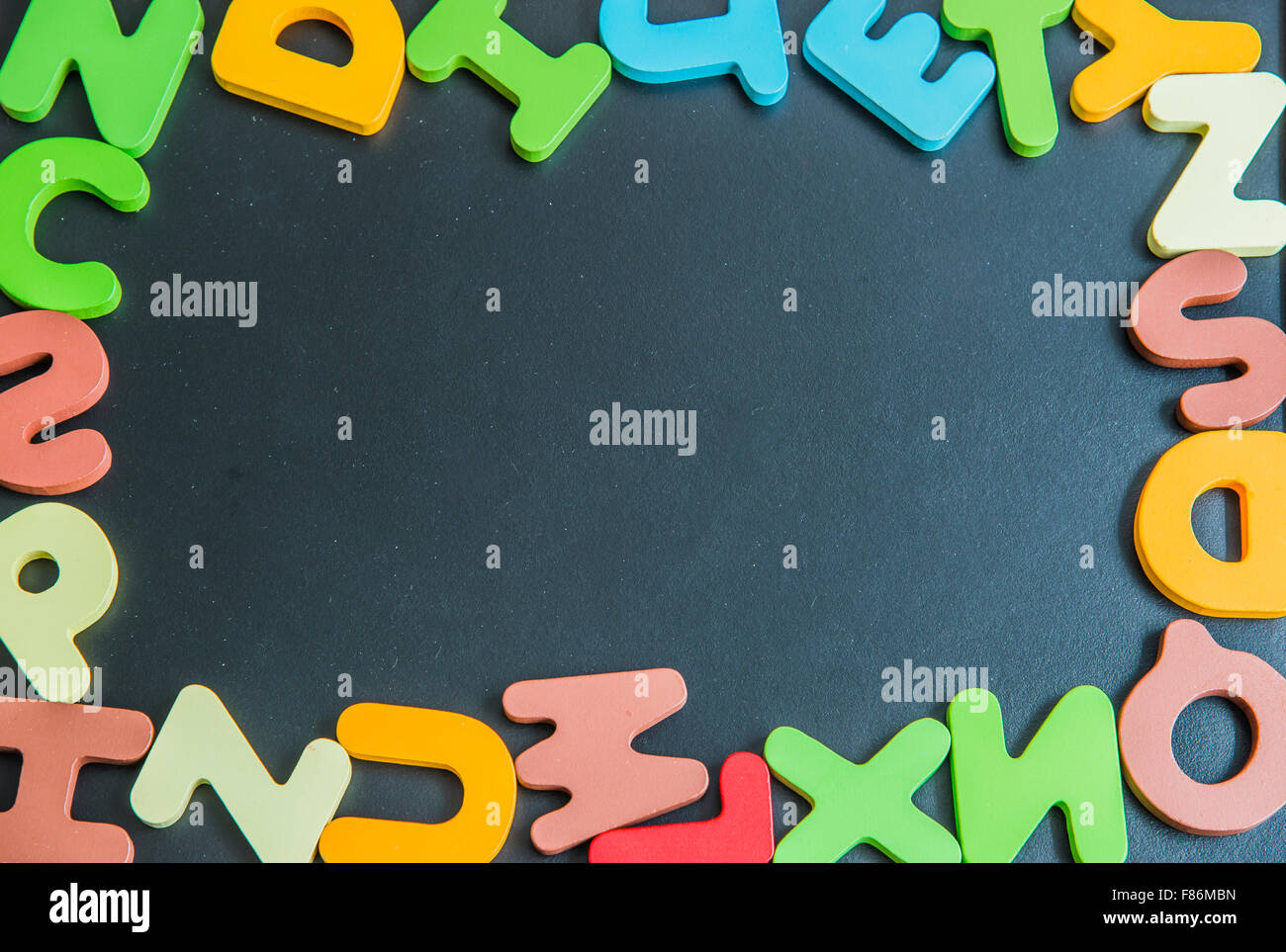 Mix Alphabet colorful wooden word on black board4 Stock Photo - Alamy