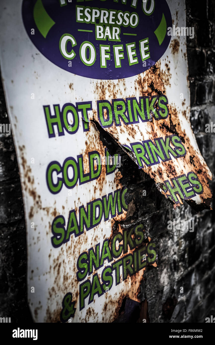 Rusty old Sign for coffee shop outside Elmstead Woods Train Station ...