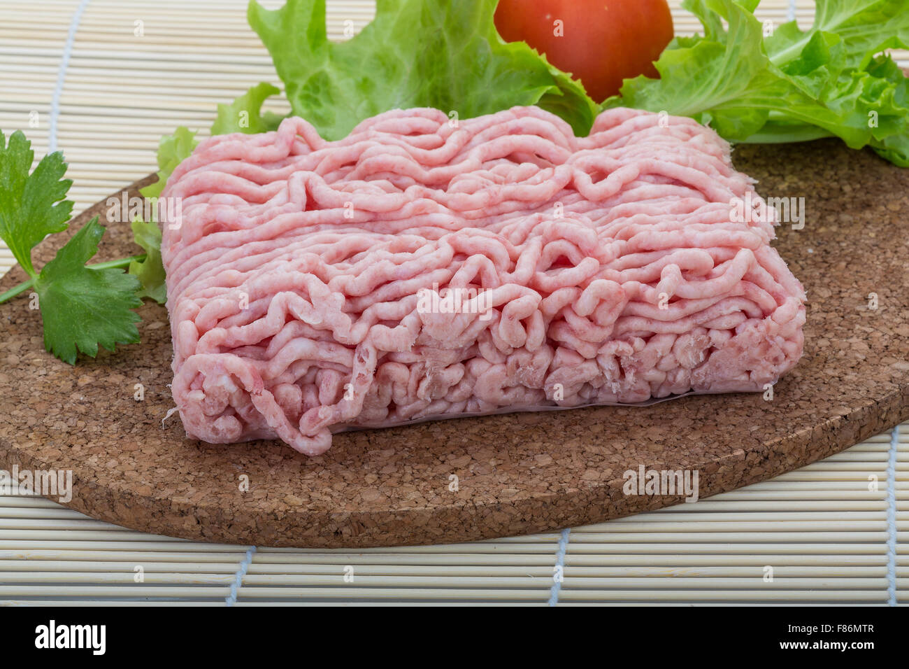 Raw minced pork meat on the desk with herbs Stock Photo - Alamy