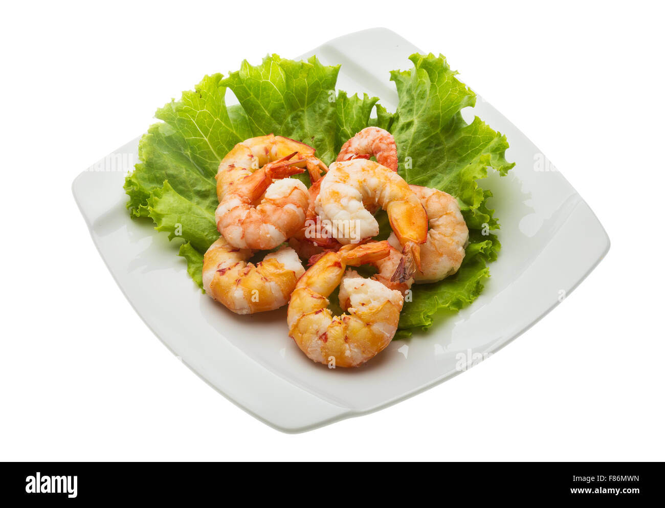 Unshelled king prawn heap with salad leaves Stock Photo - Alamy