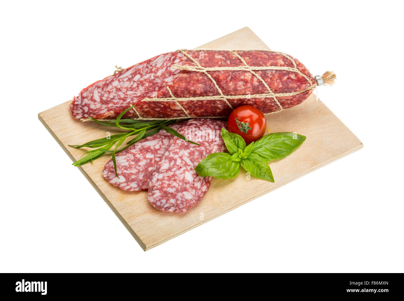 Salami sausages sliced with basil Stock Photo - Alamy