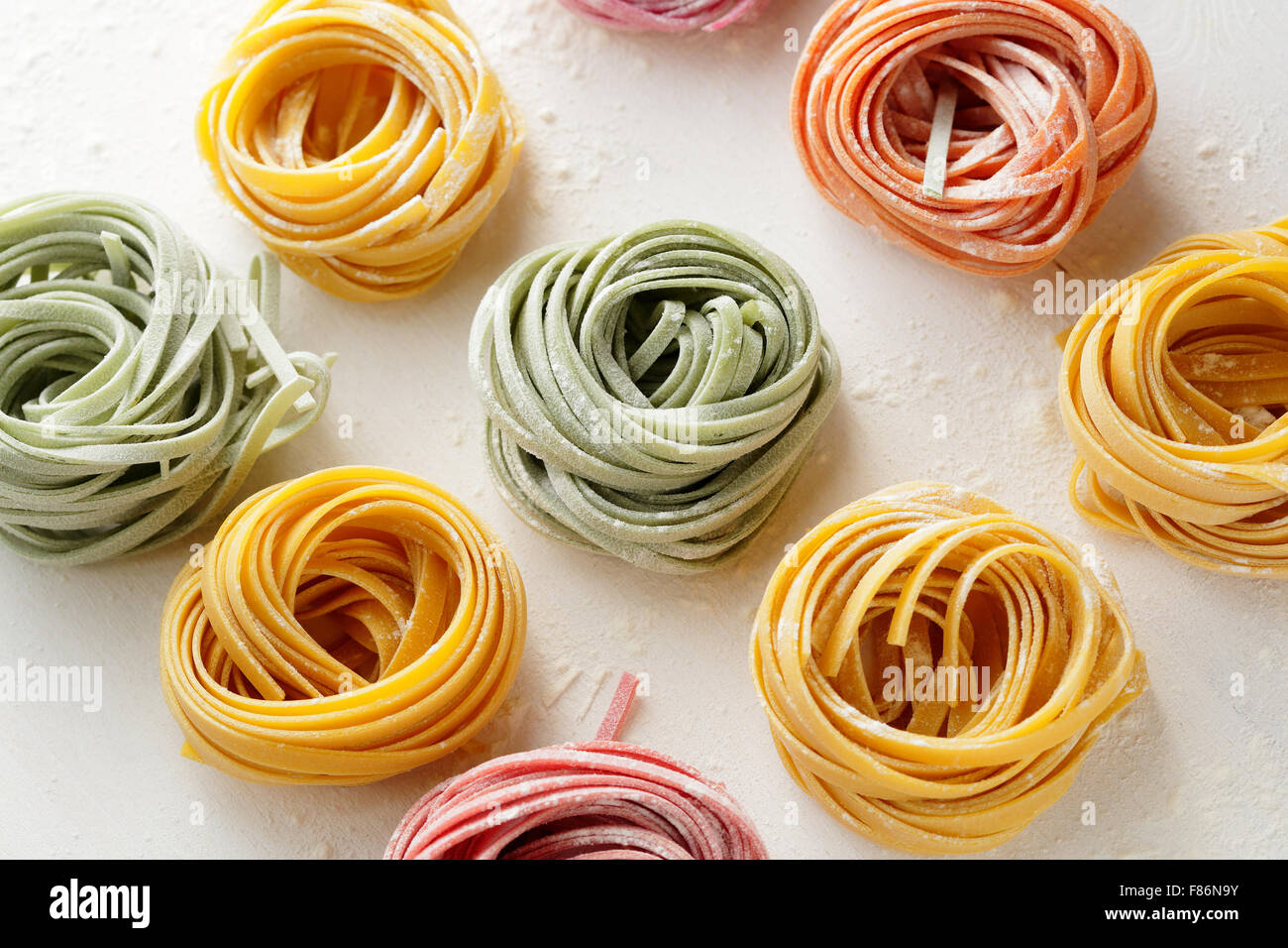 color pasta on white background, food closeup Stock Photo - Alamy