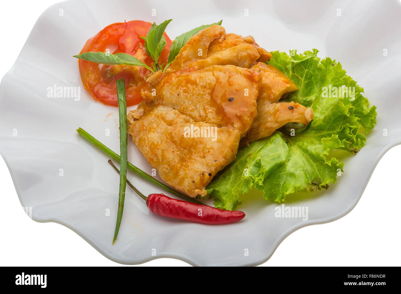 Baracuda steak with sauce and salad Stock Photo - Alamy