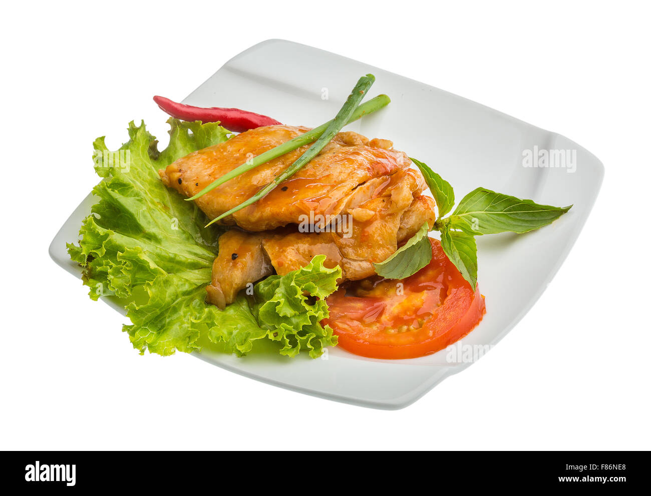 Baracuda steak with sauce and salad Stock Photo - Alamy