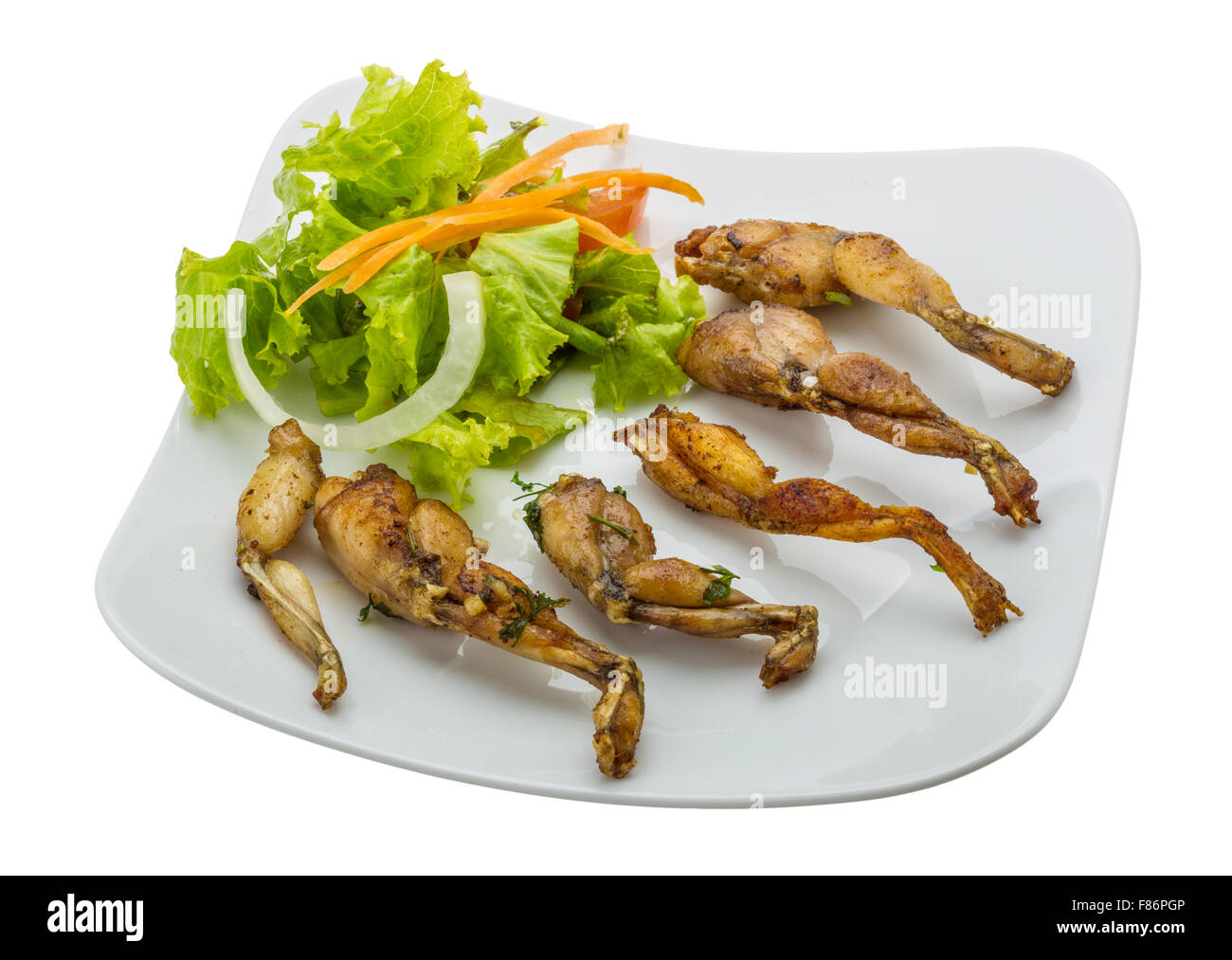Grilled frog legs - French style Stock Photo - Alamy