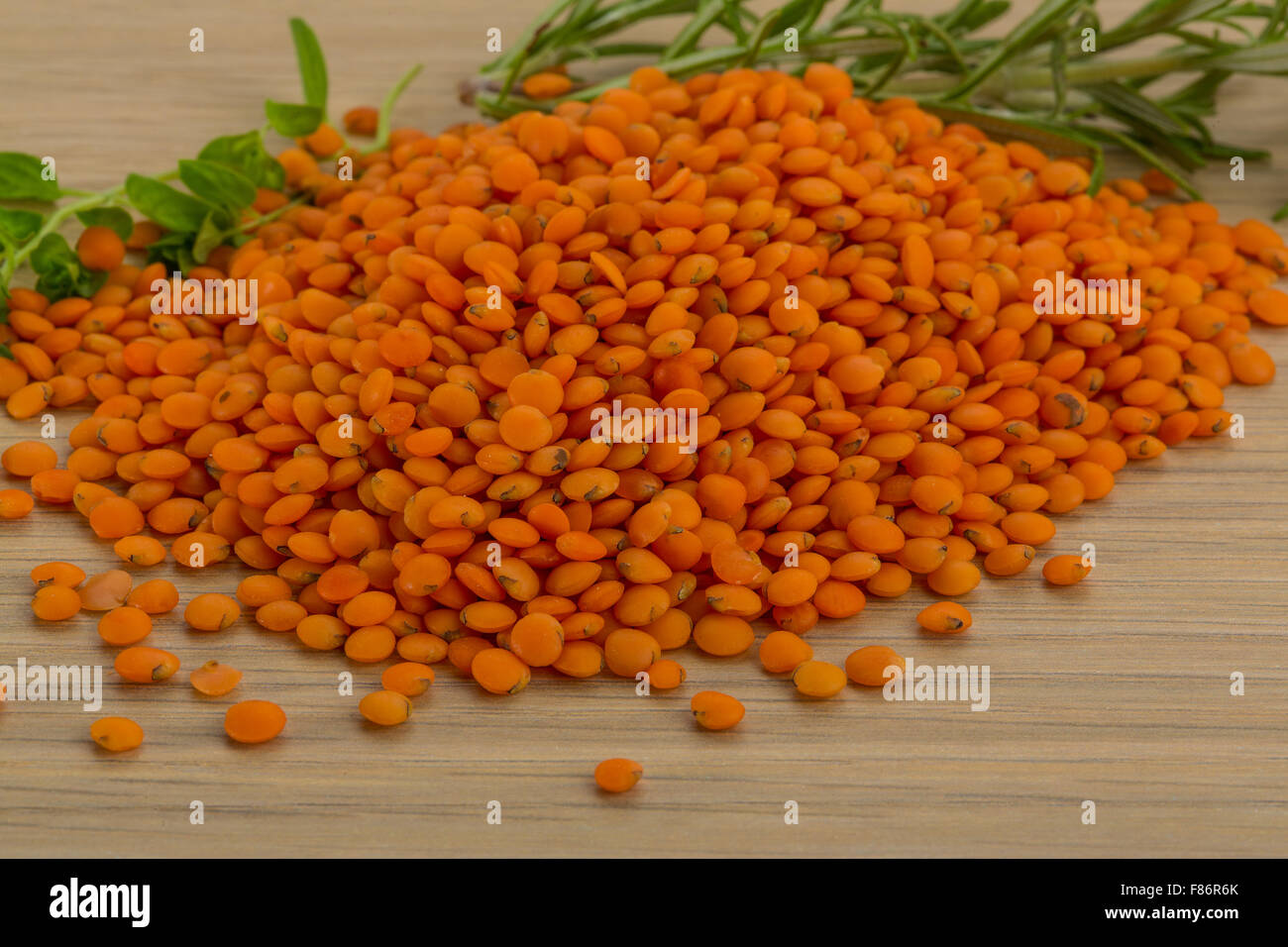 Raw red lentils on the board Stock Photo - Alamy
