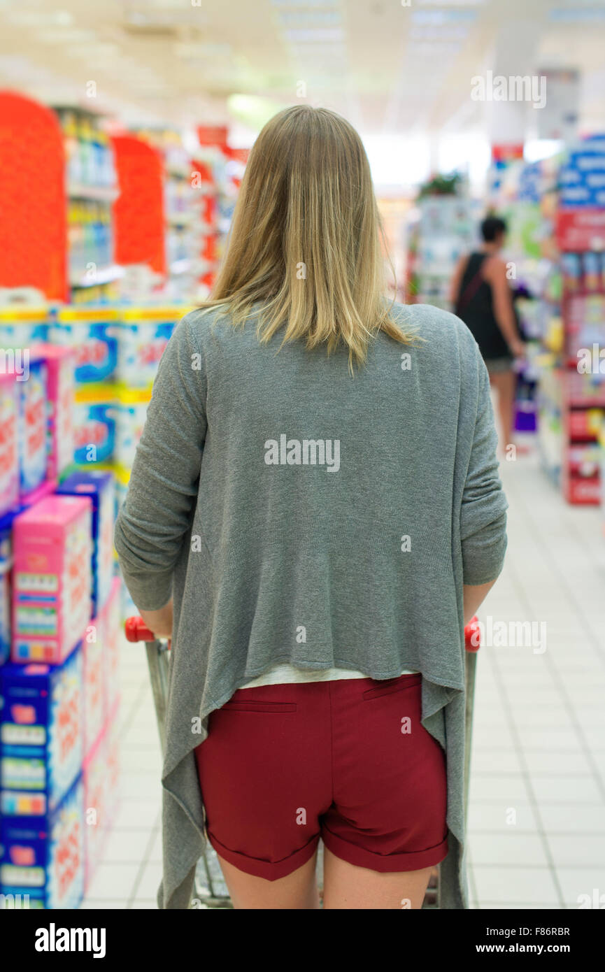 Woman shopping in the supermarket. Rear view Stock Photo - Alamy