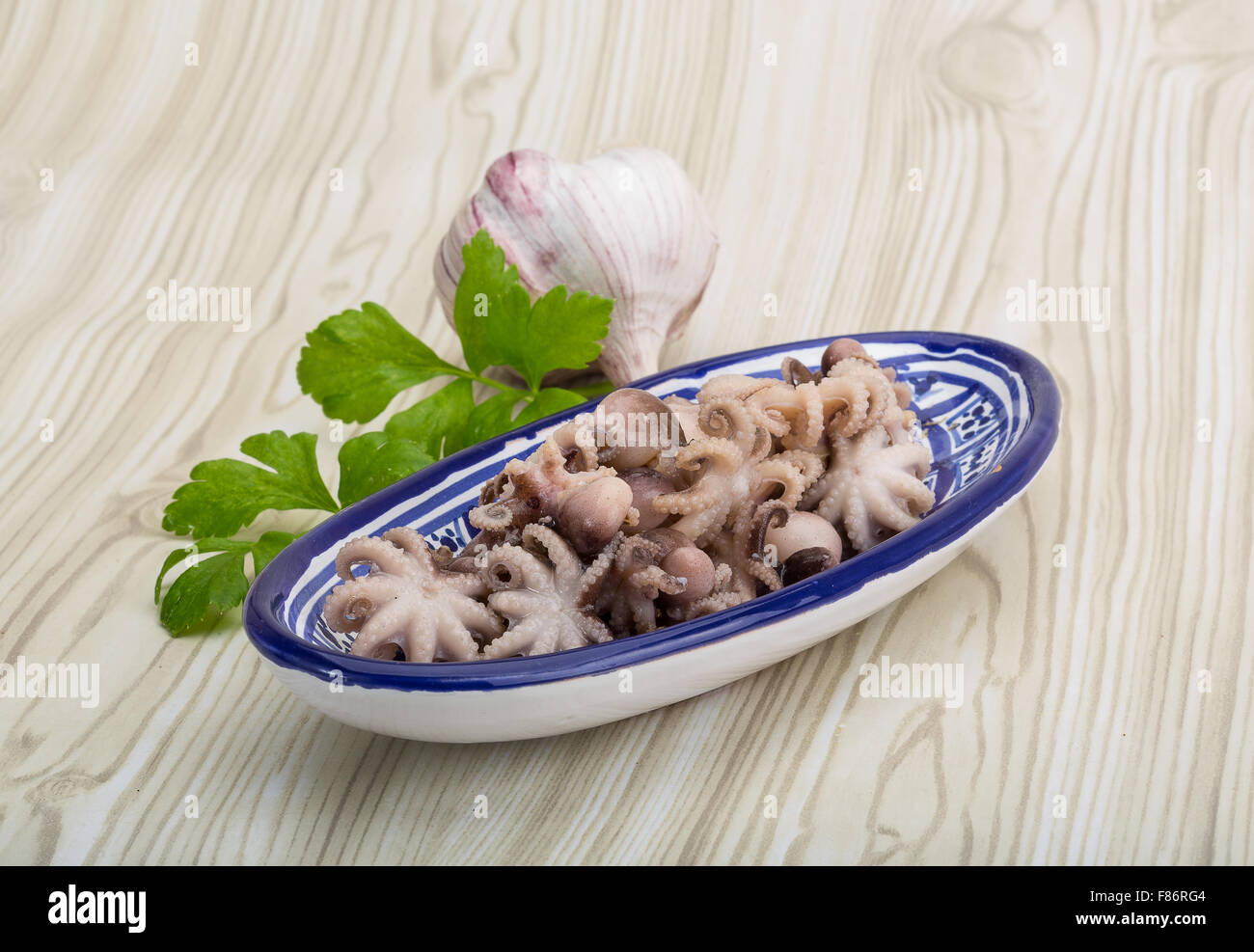 Boiled octopus - mini seafood in the bowl Stock Photo - Alamy