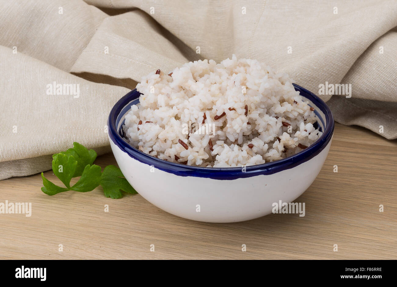 Boiled rice in the bowl on wooden background Stock Photo - Alamy