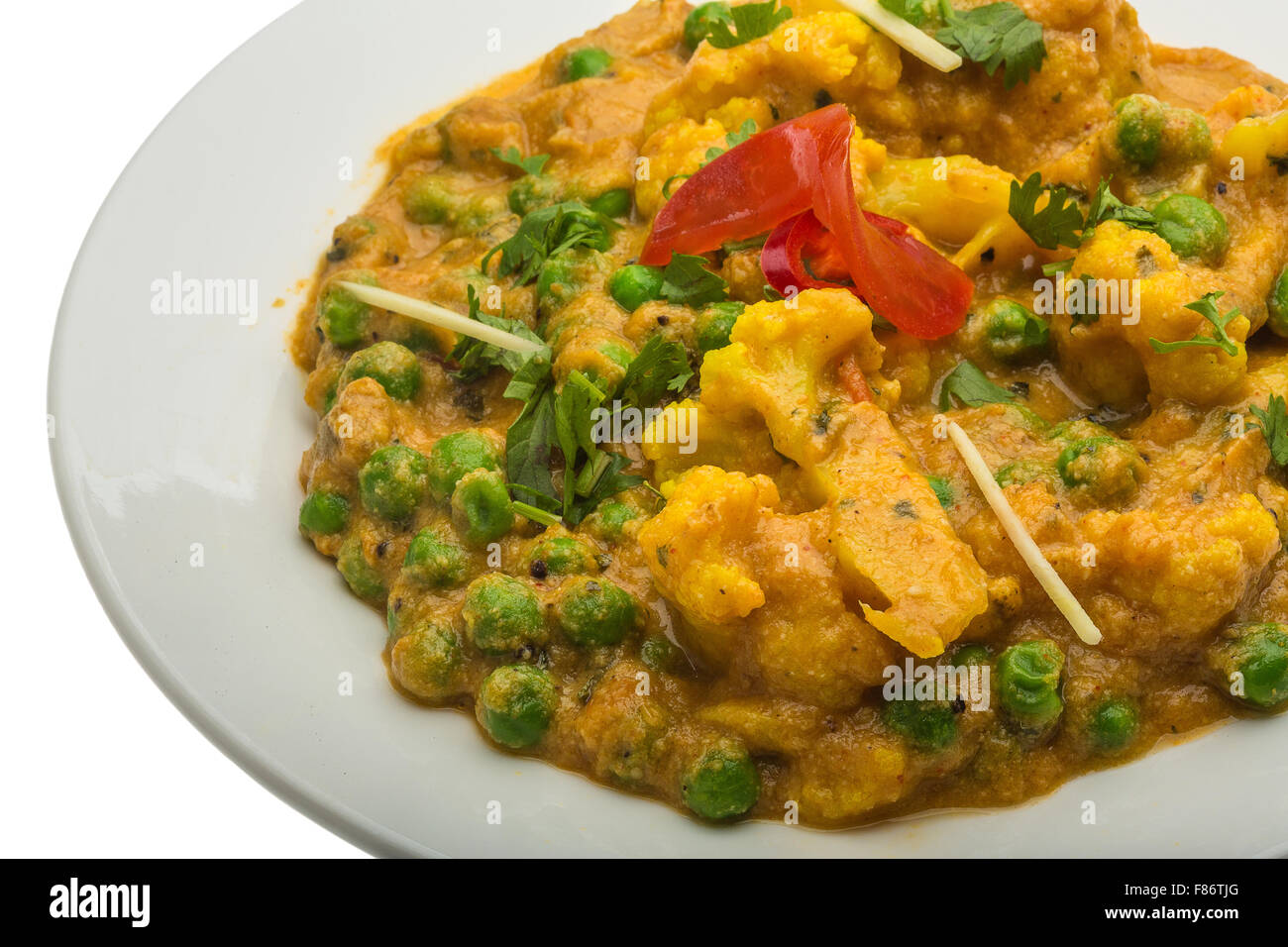 Gobi Mutter Kaju - cauliflower with green peas and cashew Stock Photo ...