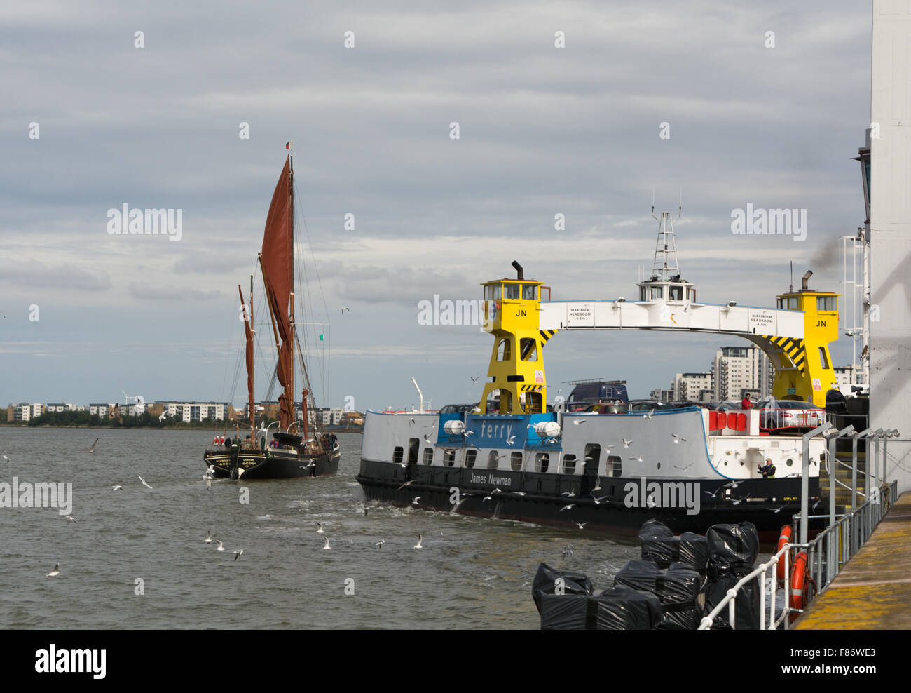 Woolwich Ferry docking at Woolwich Terminal on the River Thames, UK ...