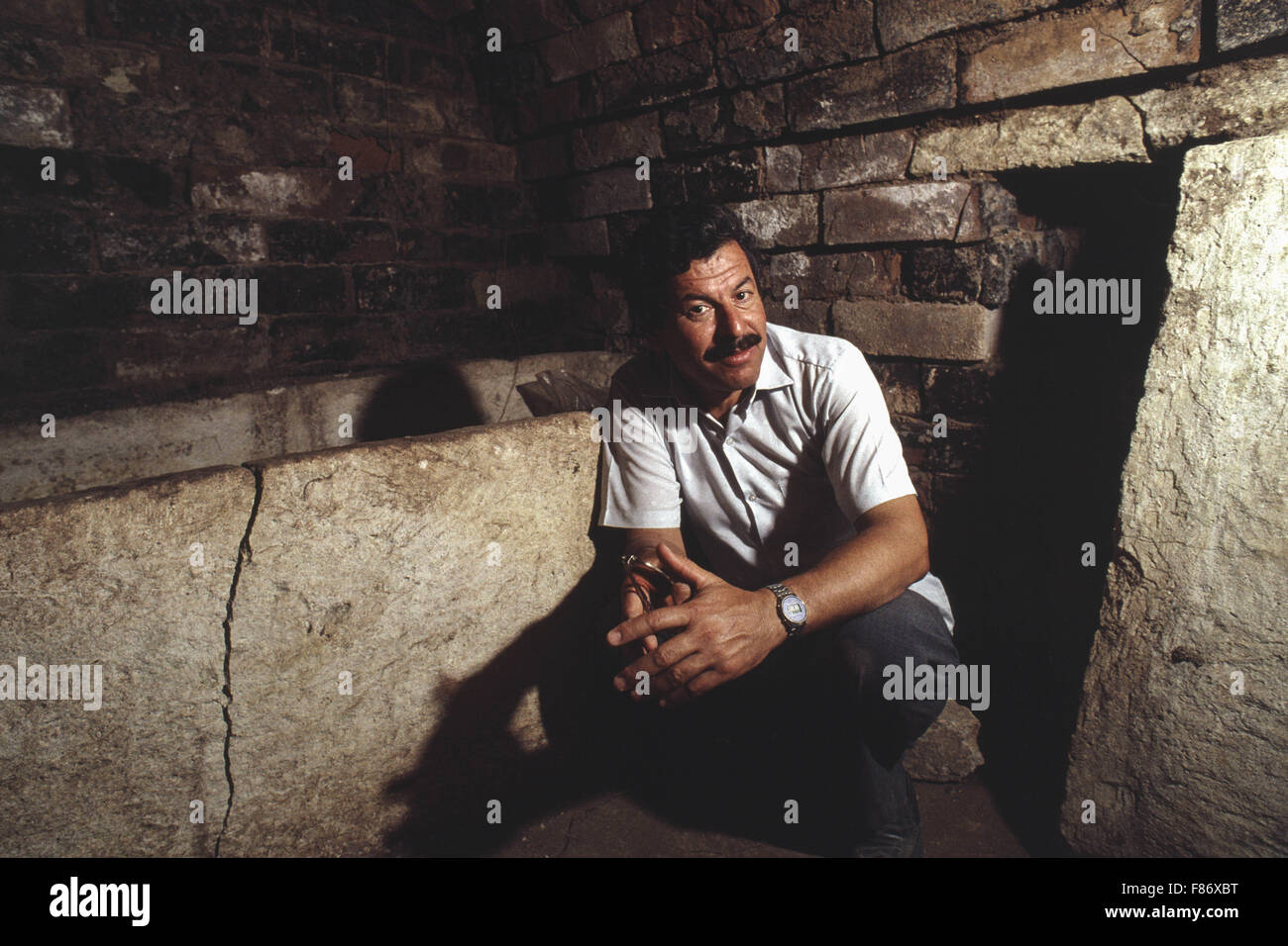 Iraqi archaeologist Mahmoud standing in the chamber where he made Iraq ...