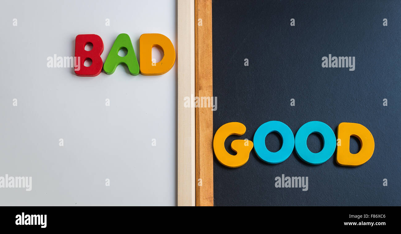 Wooden word BAD and GOOD on black board and white board Stock Photo - Alamy