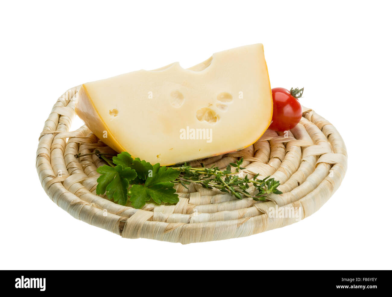 Maasdam cheese with thyme and tomato Stock Photo - Alamy