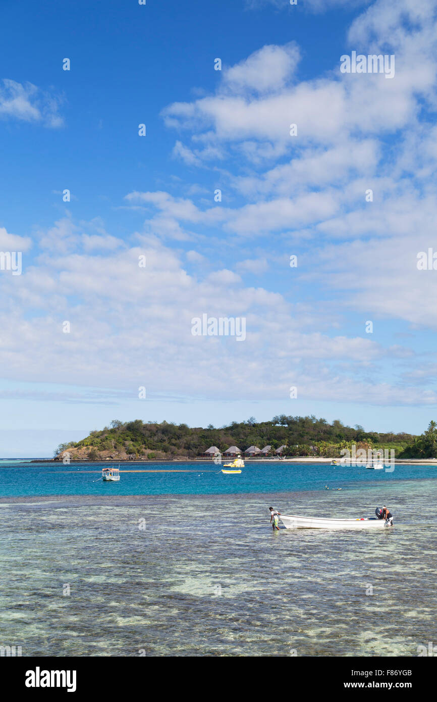 Boats in lagoon of Mana Island, Mamanuca Islands, Fiji Stock Photo - Alamy