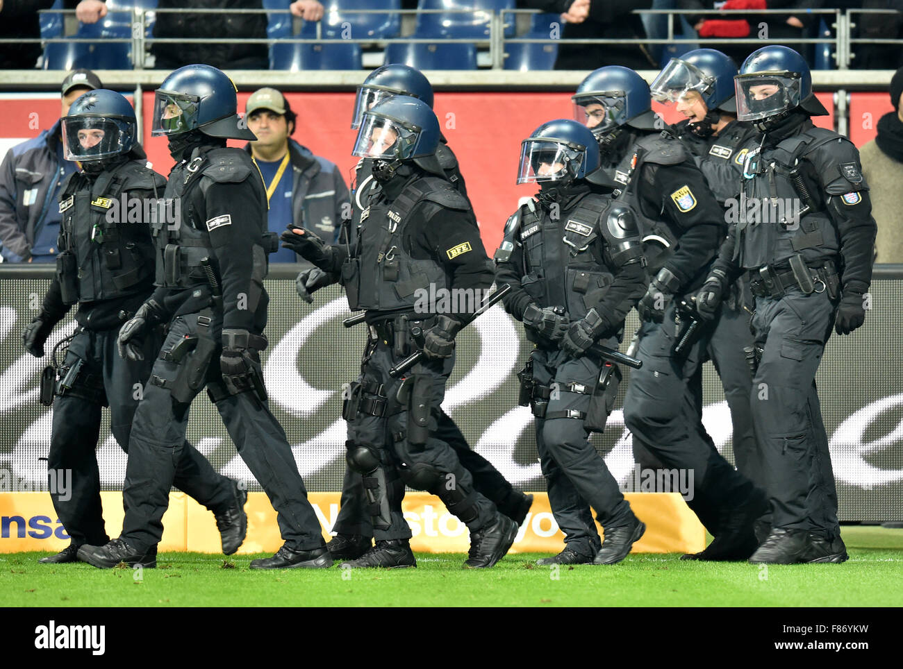 Police officer secure the pitch as soccer fans riot in the soccer ...