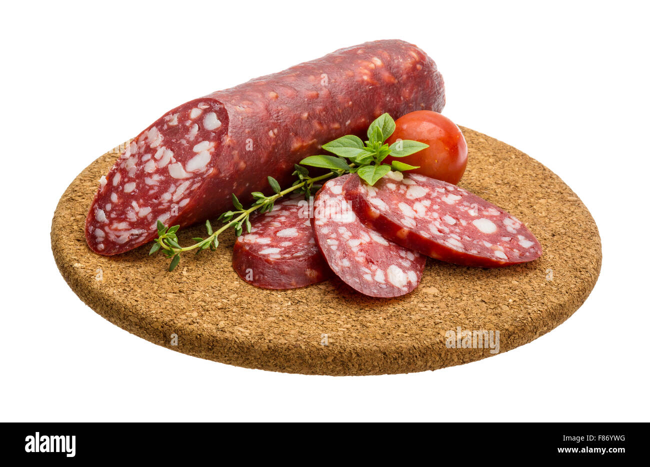 Salami sausages sliced with basil and tomato Stock Photo - Alamy