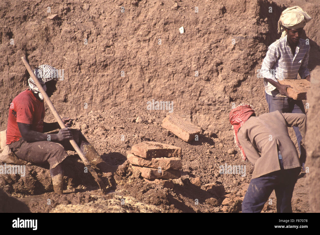Laborers reconstructing walls of the ancient royal Palace at Nimrud ...
