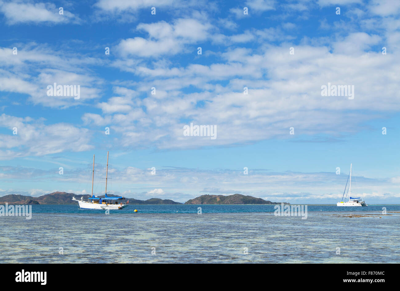 Boats in lagoon of Mana Island, Mamanuca Islands, Fiji Stock Photo - Alamy