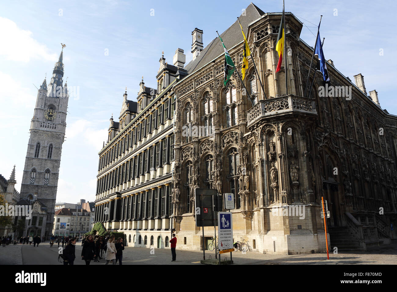 The Belfry tower and ornate facade of the Town Hall in central Ghent ...
