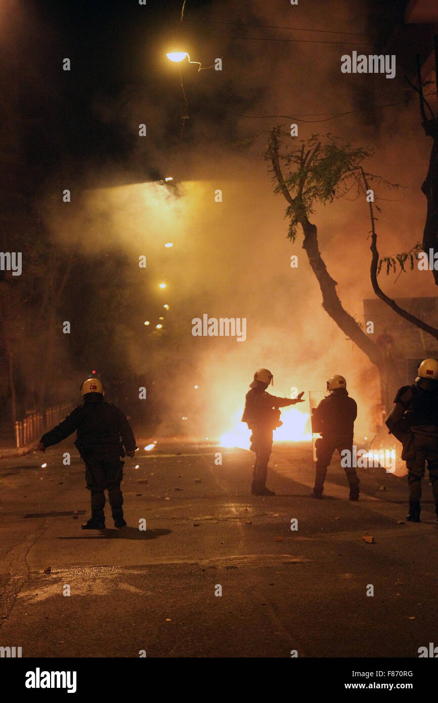 Athens, Dec. 6. 6th Dec, 2008. Greek riot police act beside a fire set ...