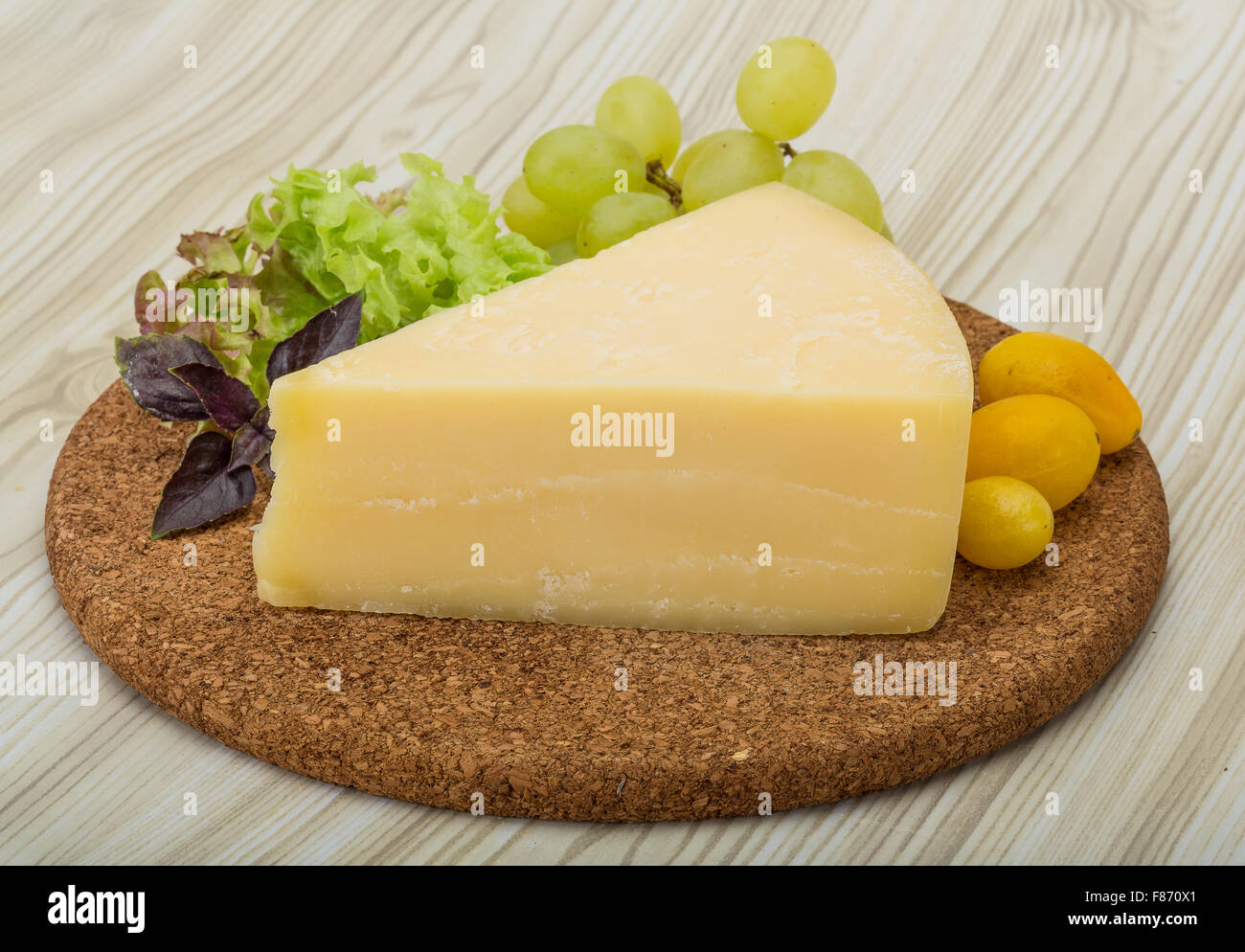 Part of parmesan cheese on the wood backgrounds Stock Photo - Alamy